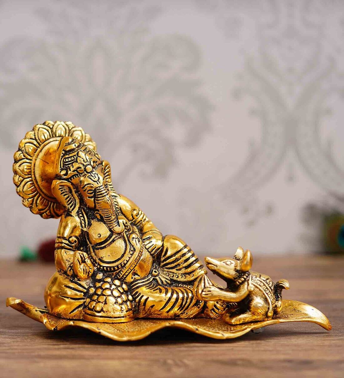 Buy Golden Metal Resting Ganesha Idol With Mushak by eCraftIndia at 31% ...